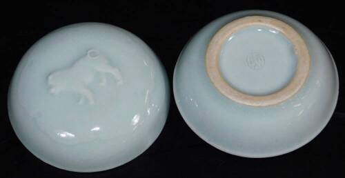 A Japanese celadon circular porcelain kogo (incense box), decorated in ...