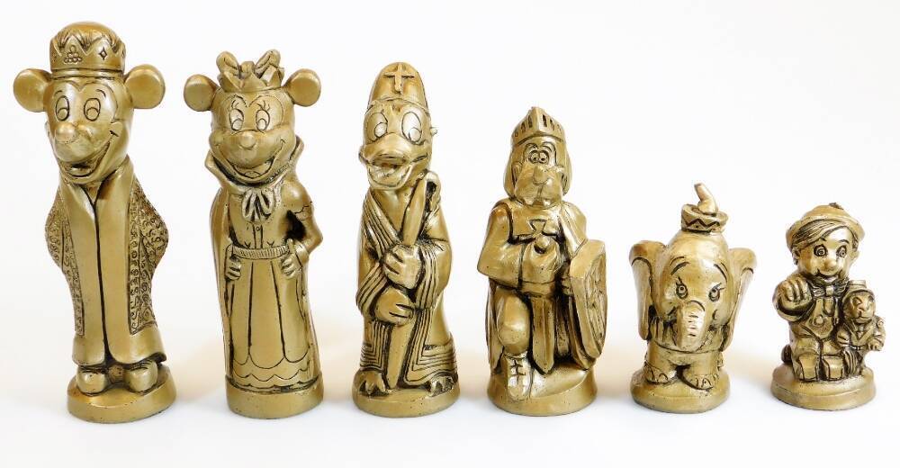Disney interest, a hardwood chess set, of oblong form, with etched ...