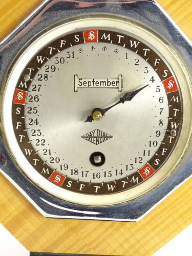 An Art Deco Day Dial calendar, with clockwork mechanism, in figured ...