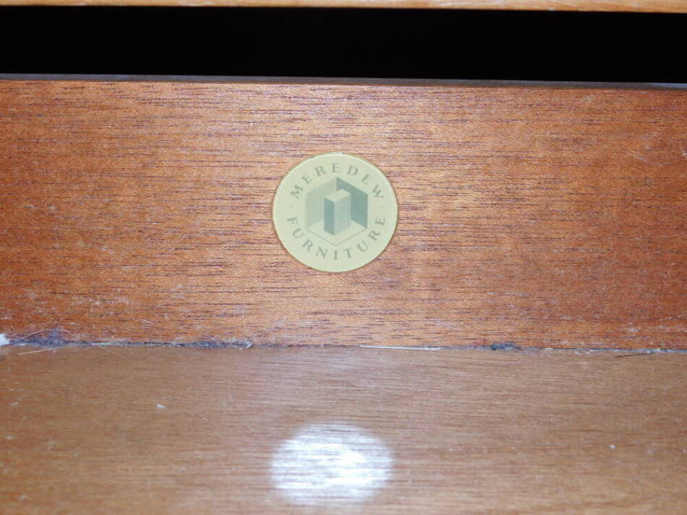 A Meredew mid-century vintage light oak dressing table, the tilting ...