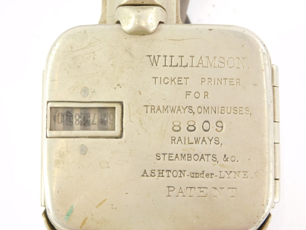 A vintage ticket punching machine, stamped Williamson ticket printer ...