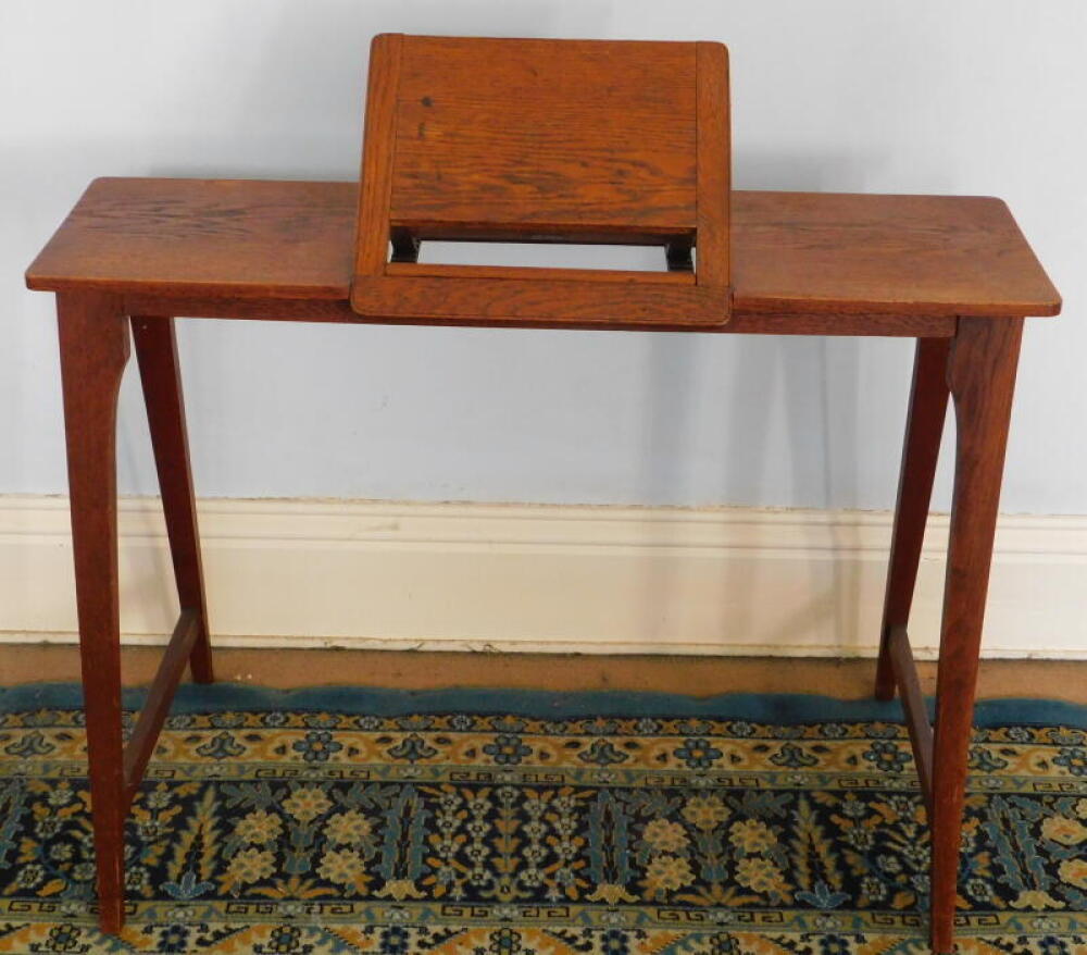An Edwardian oak reading table, with lectern centre.