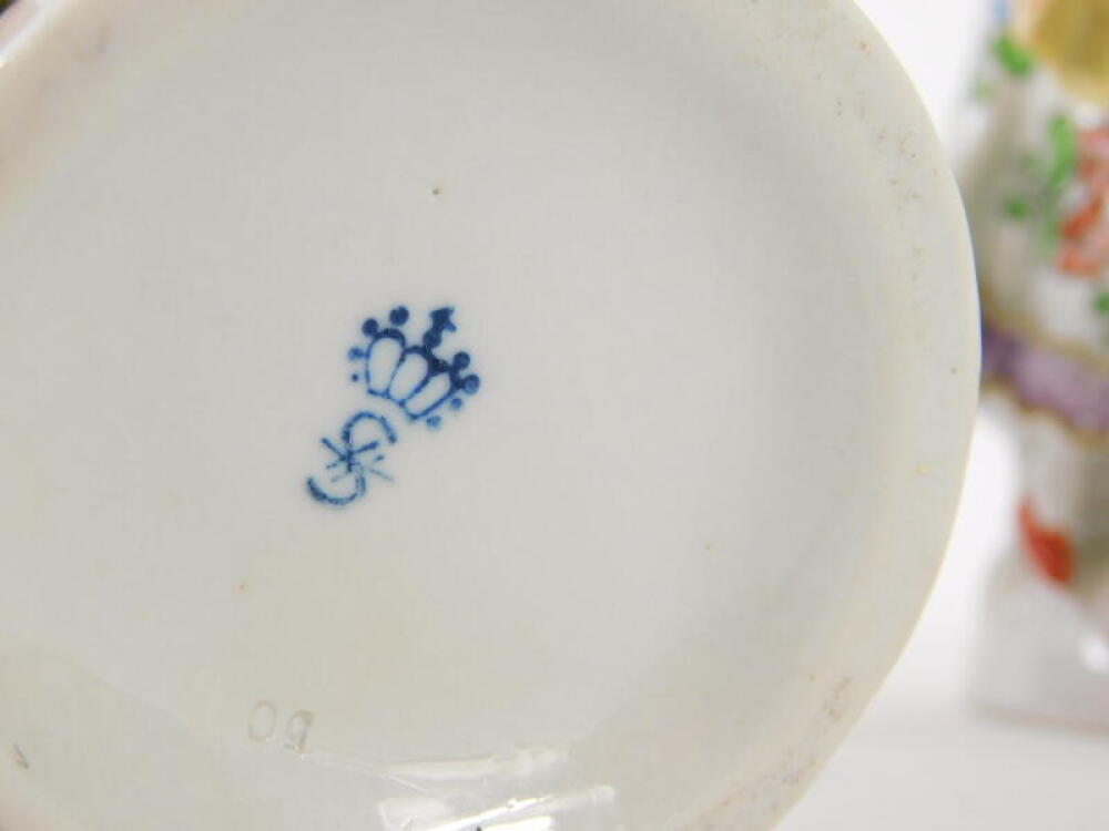 A pair of late Sitzendorf figures of a shepherd and shepherdess, in ...