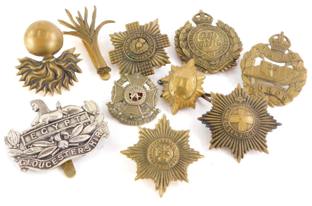 A collection of regimental cap and other badges, to include the WWI ...