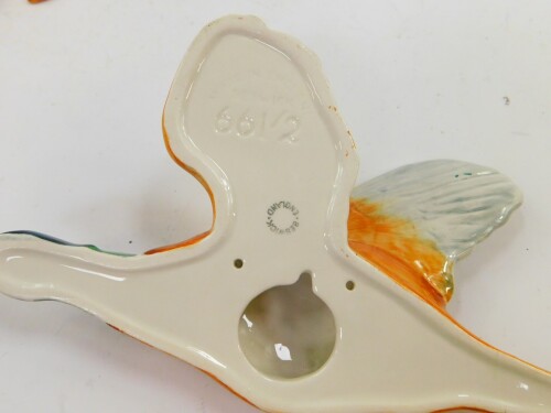 A set of three Beswick pottery graduated wall plaques modeled as ...