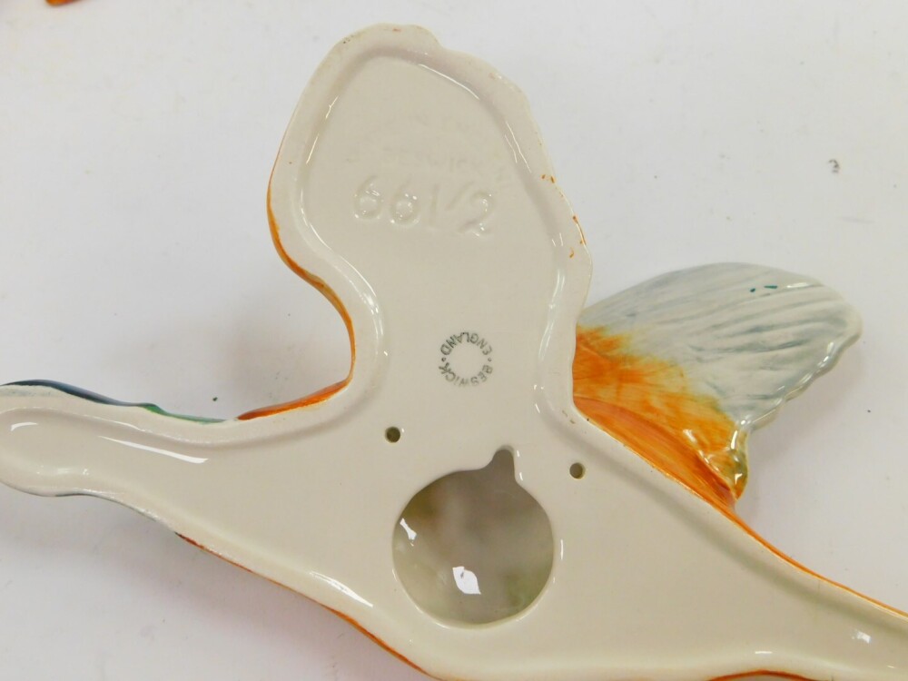 A set of three Beswick pottery graduated wall plaques modeled as ...