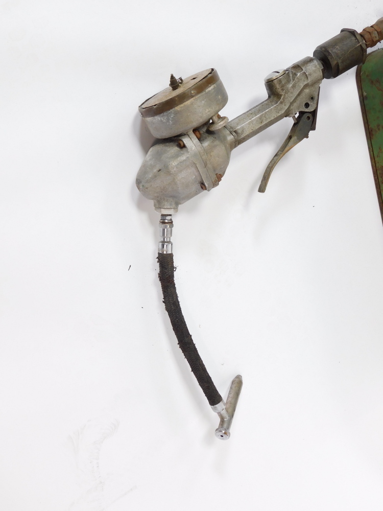 A Castrol Wakefield Lubrequipment garage oil dispenser.