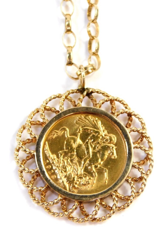 A George V full gold sovereign pendant and chain, dated 1913, in a ...