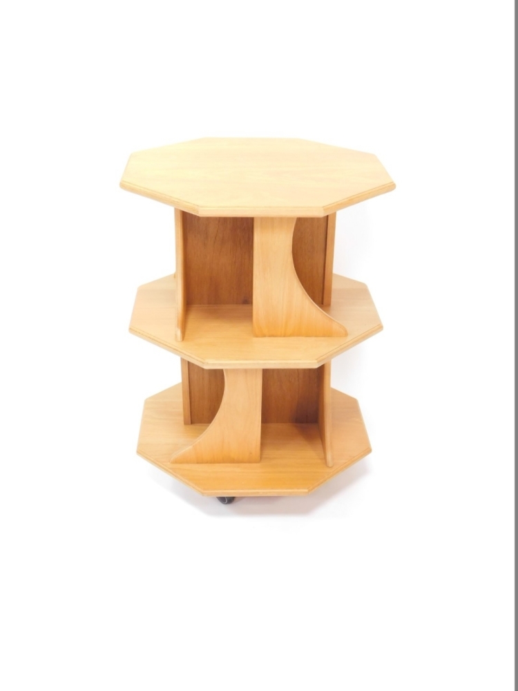 A 20thC light wood rotating bookcase, of octagonal form on a rotating ...