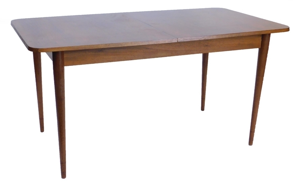 An Archie Shine designed teak extending dining table, the rectangular ...