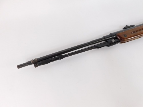 A Lion Brand spring powered air rifle, calibre .22.