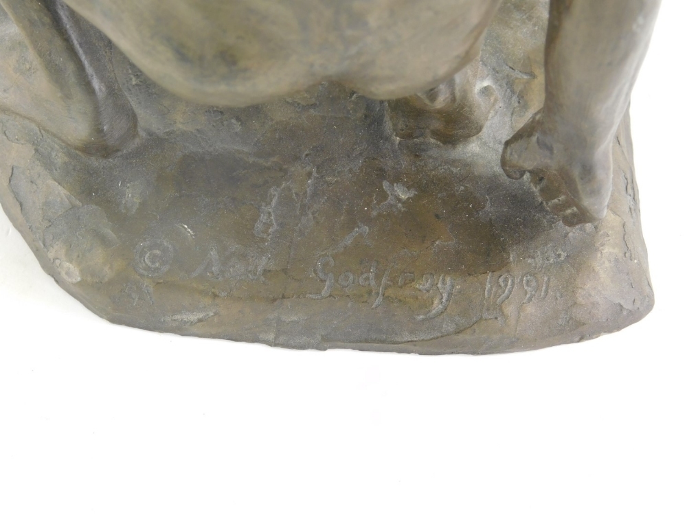 A bronzed finish resin sculpture, after Neil Godfrey, depicting a male ...