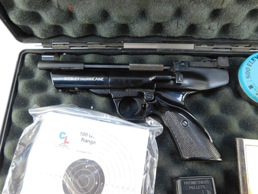 A Webley and Scott Hurricane air pistol, .22 caliber, with range cards ...
