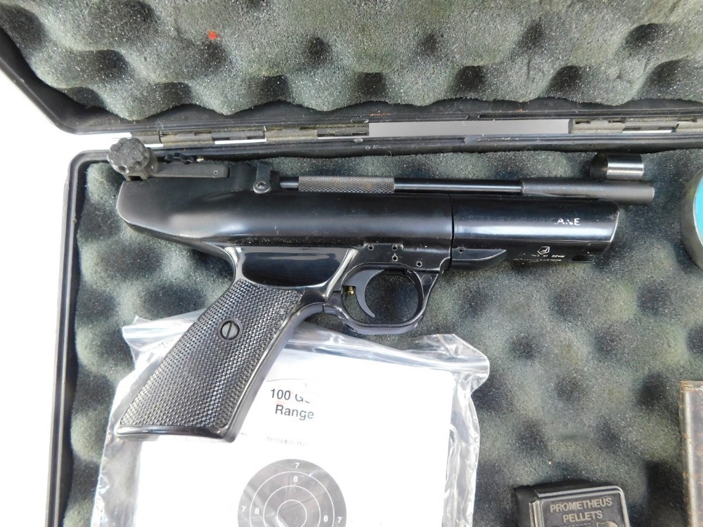 A Webley and Scott Hurricane air pistol, .22 caliber, with range cards ...