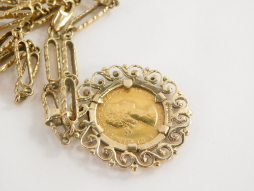 An Elizabeth II full gold sovereign pendant and chain, dated 1966 in ...