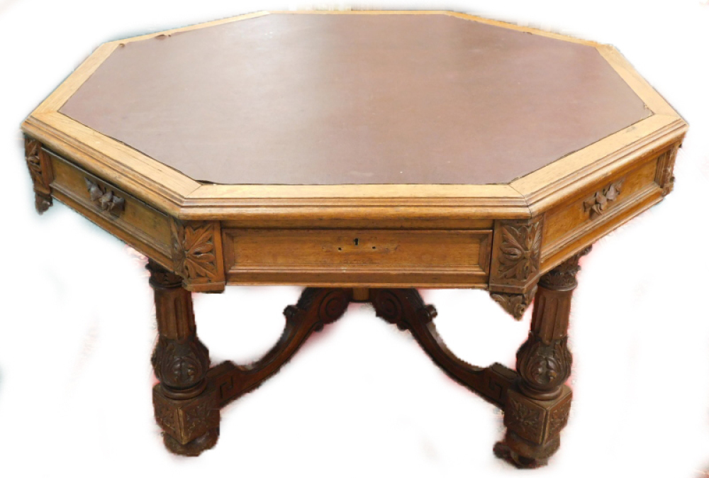 A Victorian carved oak library table in the manner of Pugin, the ...