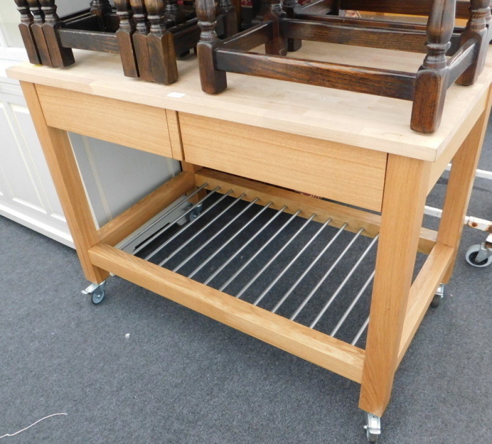 A modern hardwood freestanding butchers block, with two sliding drawers ...