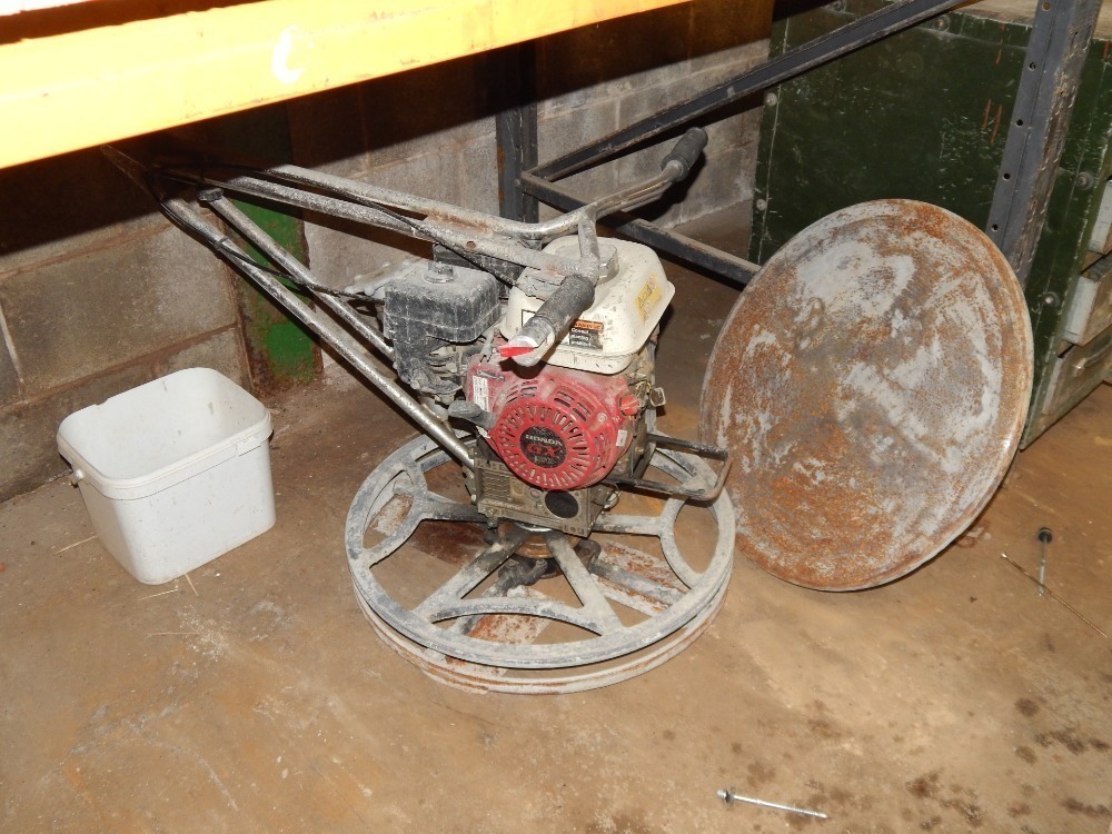 A rotary trowel float with Honda GX 120 petrol engine.