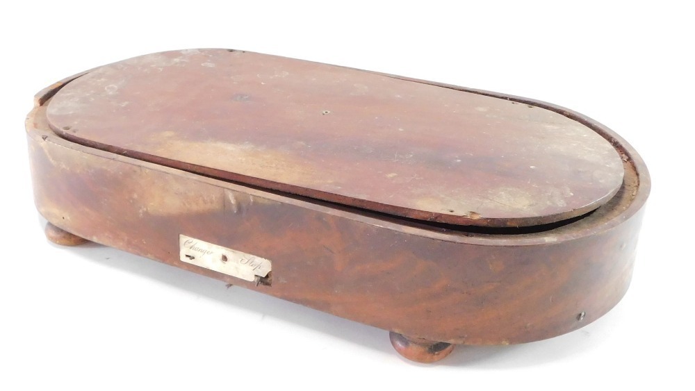 An early Victorian flame mahogany oval musical automaton base, with ...