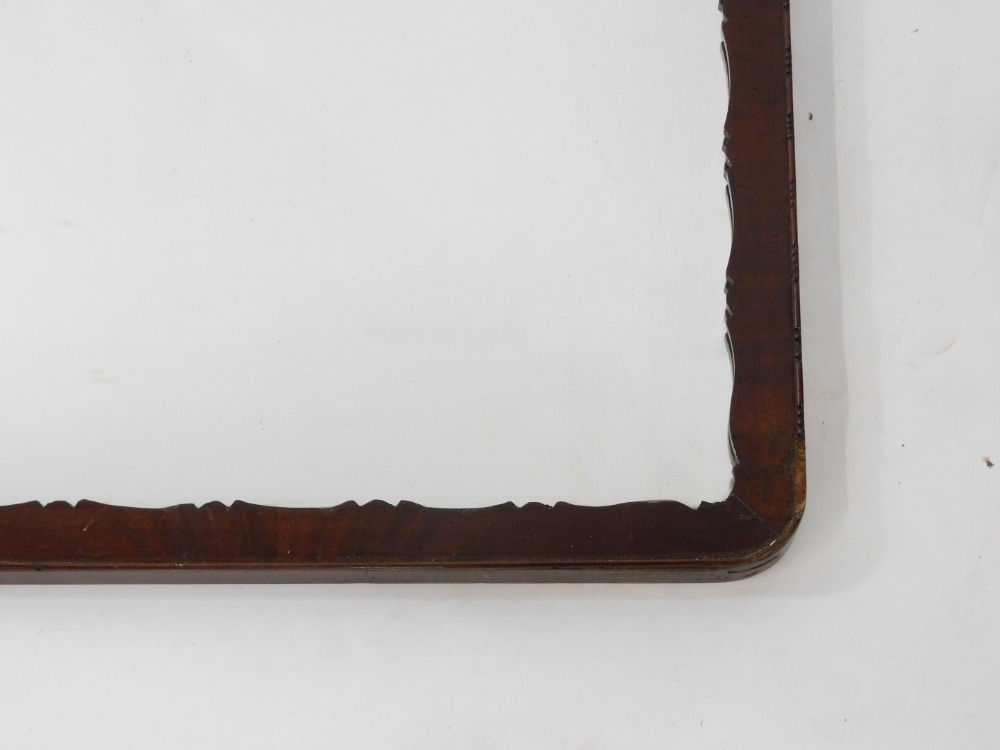 An early 20thC rectangular mahogany wall mirror, with ribbed and beaded ...