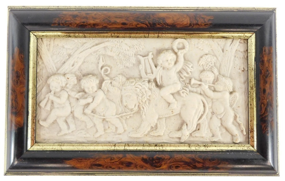 A reconstituted marble plaque depicting cherubs and lion, 29cm x 14.5cm ...