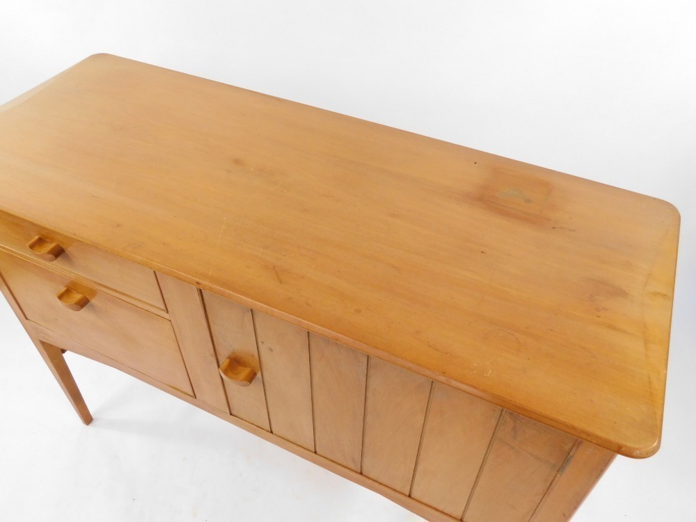 A mid century beech sideboard, with rounded corners, with two drawer ...