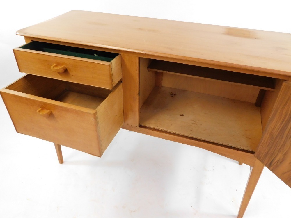 A mid century beech sideboard, with rounded corners, with two drawer ...