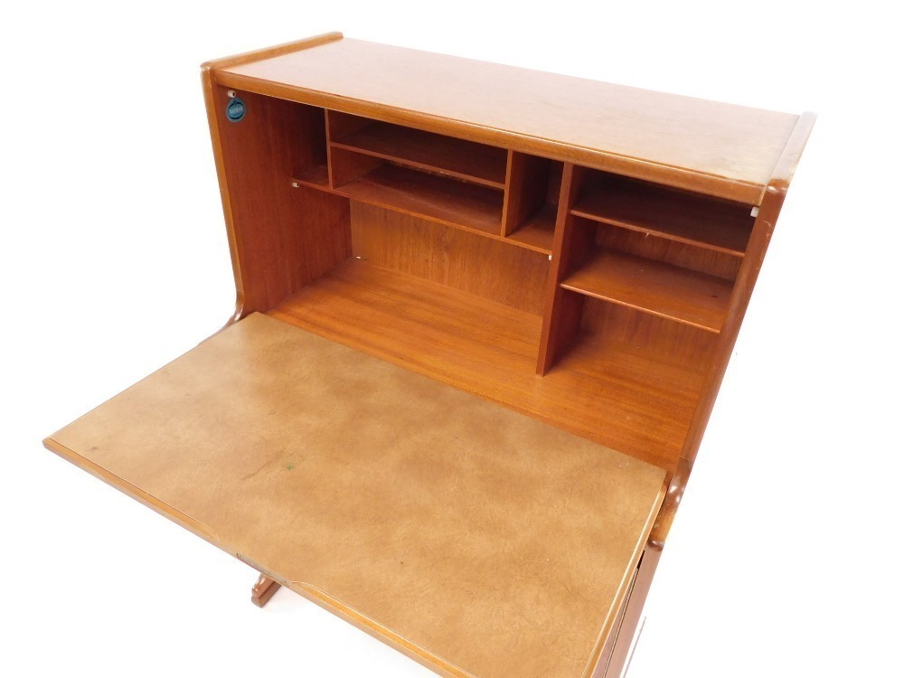 A Nathan 1960's teak bureau, the drop front top opening to reveal ...