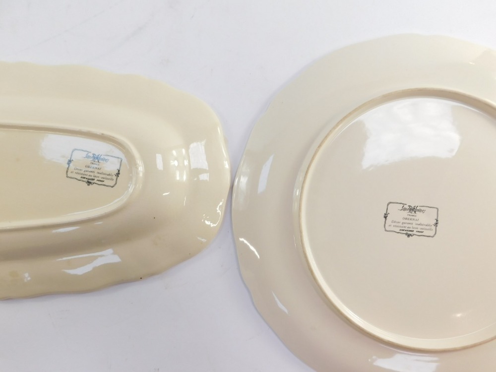 Two Sarreguemines Obernai pottery dishes, one circular depicting a lady ...