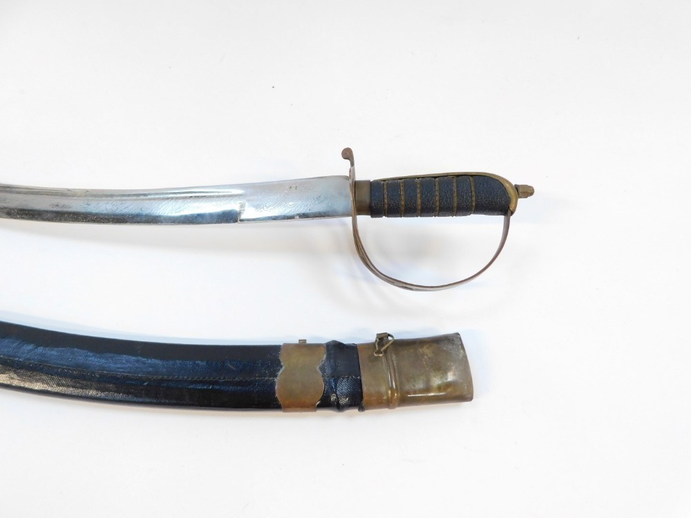 An Indian short sword, with engraved blade, and wire bound leather grip ...