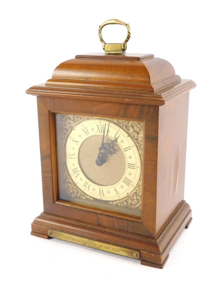 A walnut cased Rotherham's mantel clock, the carved three point top ...