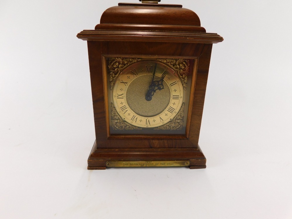 A walnut cased Rotherham's mantel clock, the carved three point top ...
