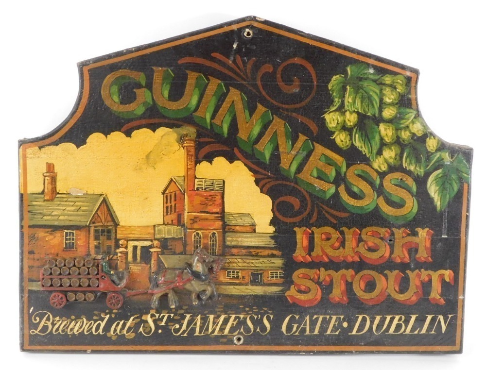 A Guinness Irish Stout wooden advertising sign, the arched top on a ...