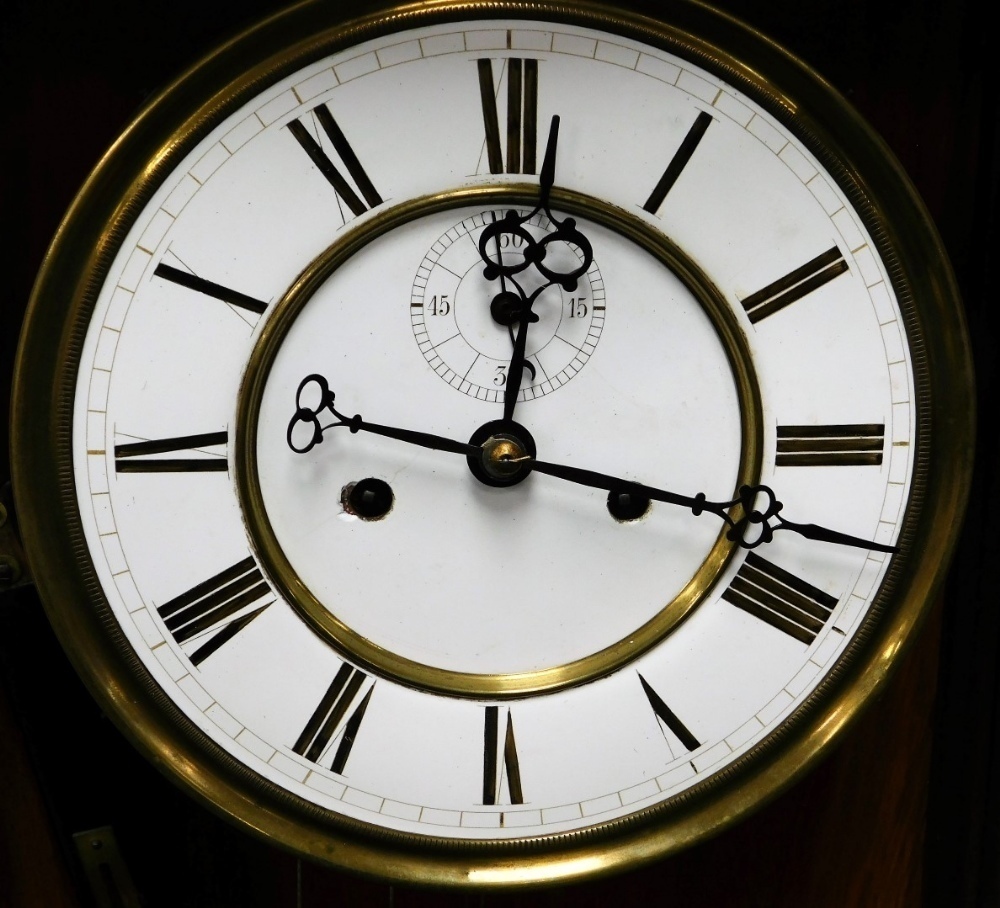 A late 19thC Vienna wall clock, in a walnut and ebonised case, the ...