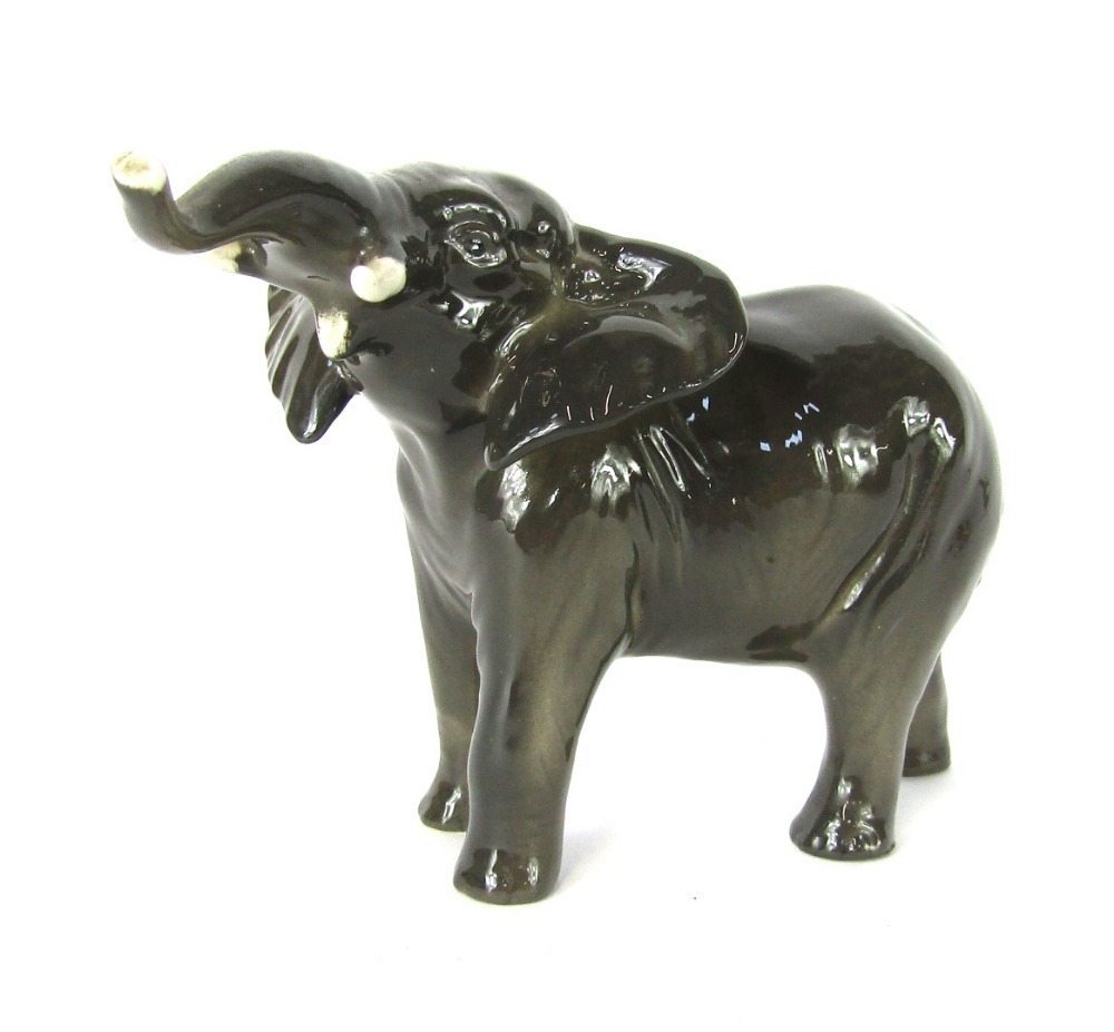 A Beswick model of an Elephant, with short trunk and two tusks, black ...