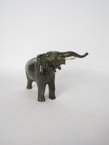 A Beswick model of an Elephant, with short trunk and two tusks, black ...
