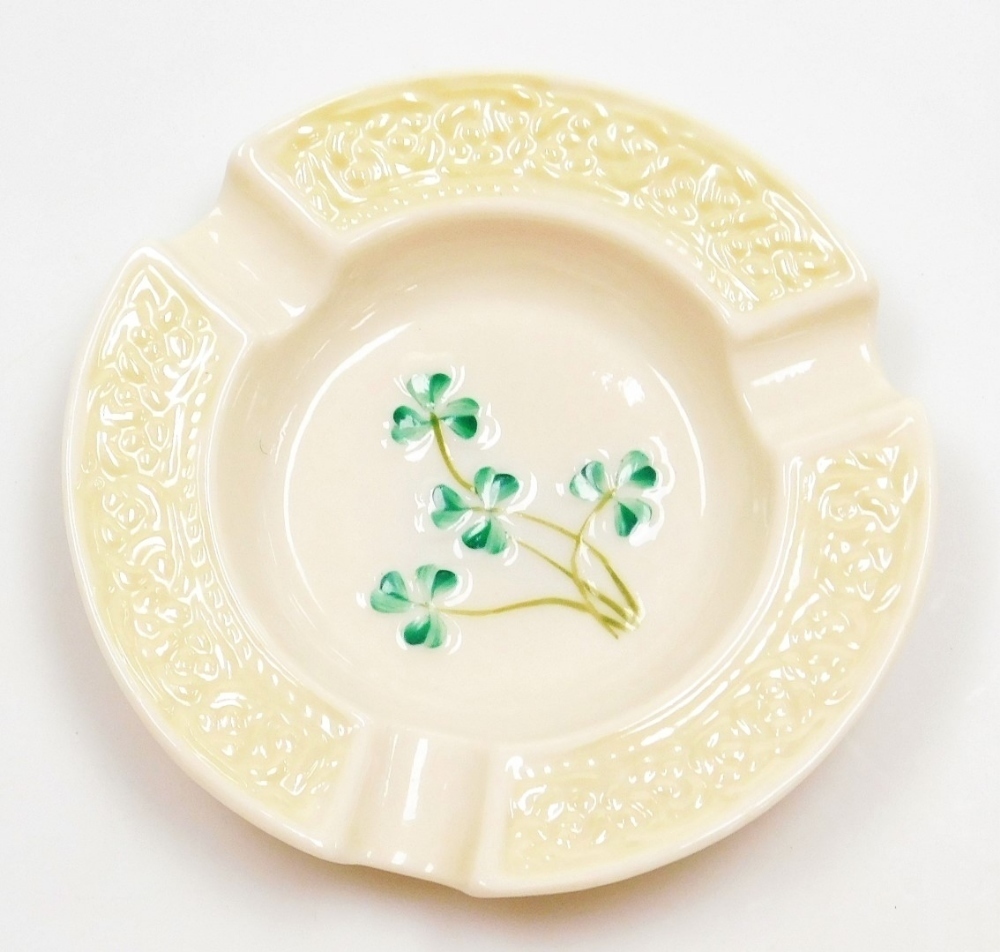 A group of Belleek pottery decorated in the Shamrock pattern, various ...