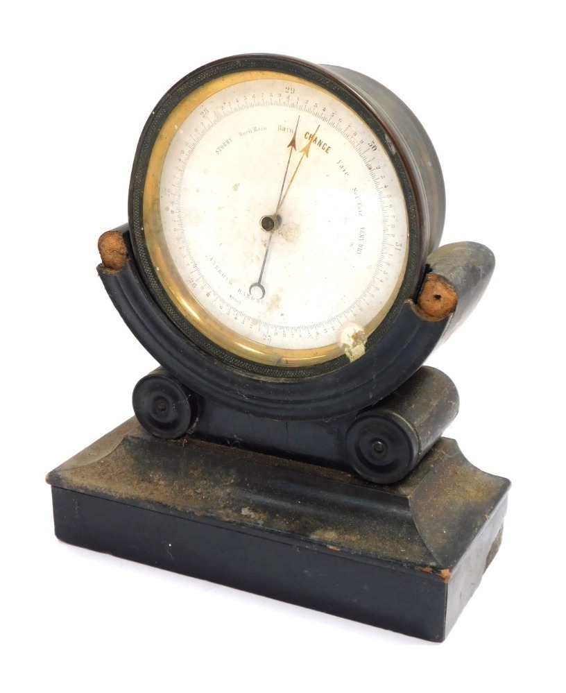 A 19thC aneroid barometer, the white enamel casing in a metal surround ...