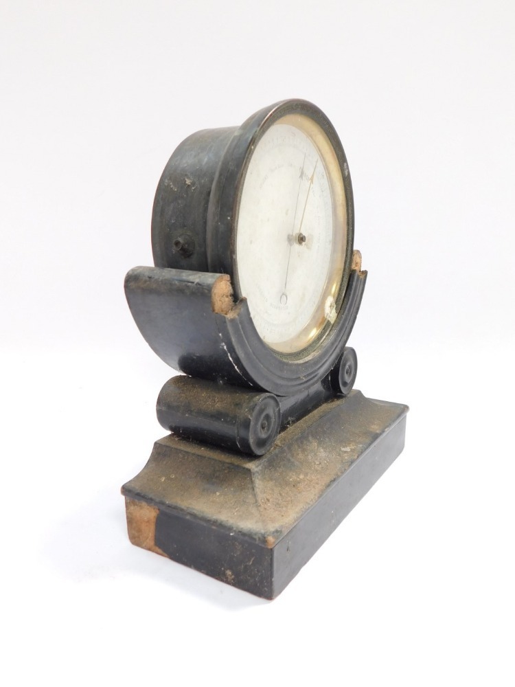 A 19thC aneroid barometer, the white enamel casing in a metal surround ...