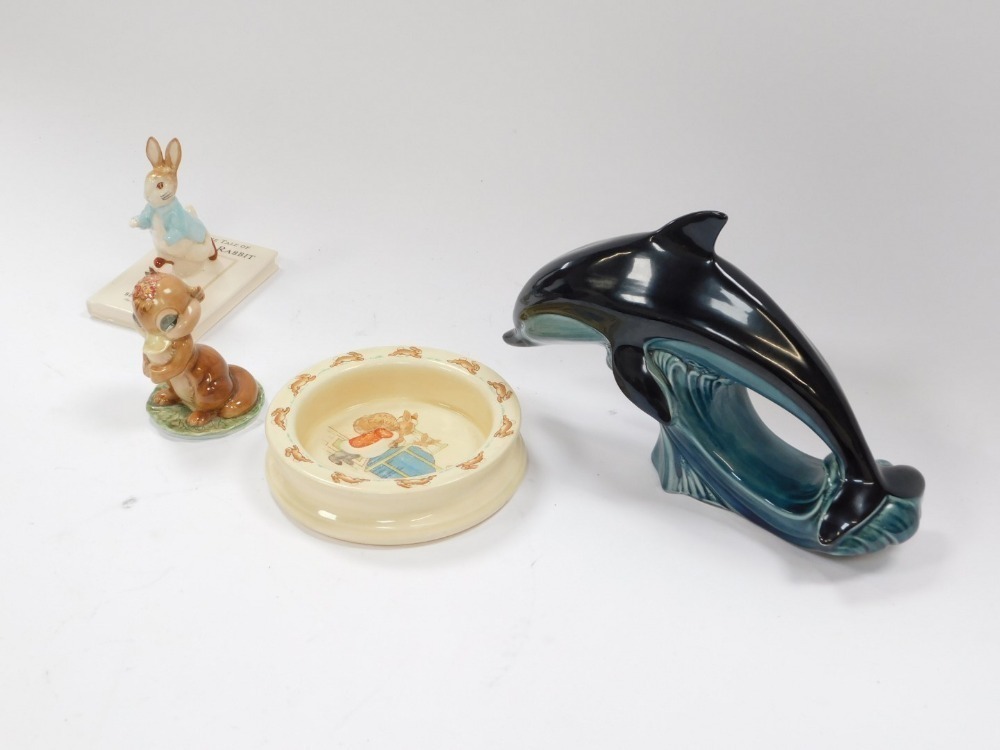 A Poole Pottery dolphin, a David Hand Animaland Dinkum Platypus figure ...