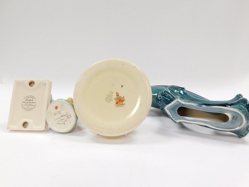 A Poole Pottery dolphin, a David Hand Animaland Dinkum Platypus figure ...