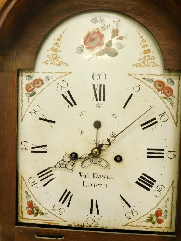 Val. Downs, Louth. A 19thC longcase clock, the arched dial painted with ...