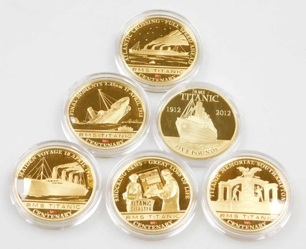 A part set of RMS Titanic Centenary gold coloured medallions, issued by ...