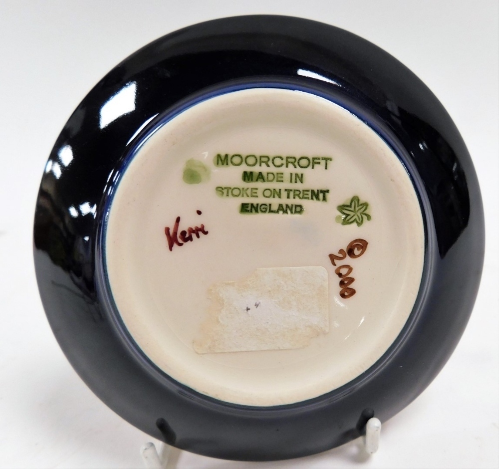 A Moorcroft pottery pin dish decorated in the Pheasants Eye pattern ...