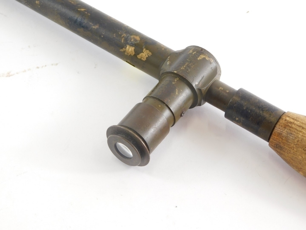 A WWI periscope, with turned wooden handle and cylindrical metal ...