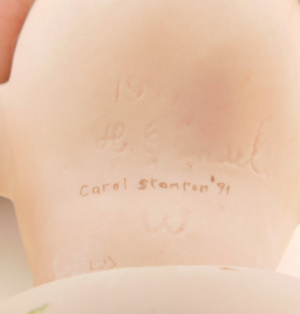 A Carol Stanton bisque porcelain doll, c1991, with fixed eyes, closed ...