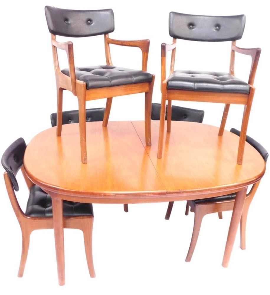 A Vanson retro teak dining suite, an extending dining table, on tapered ...