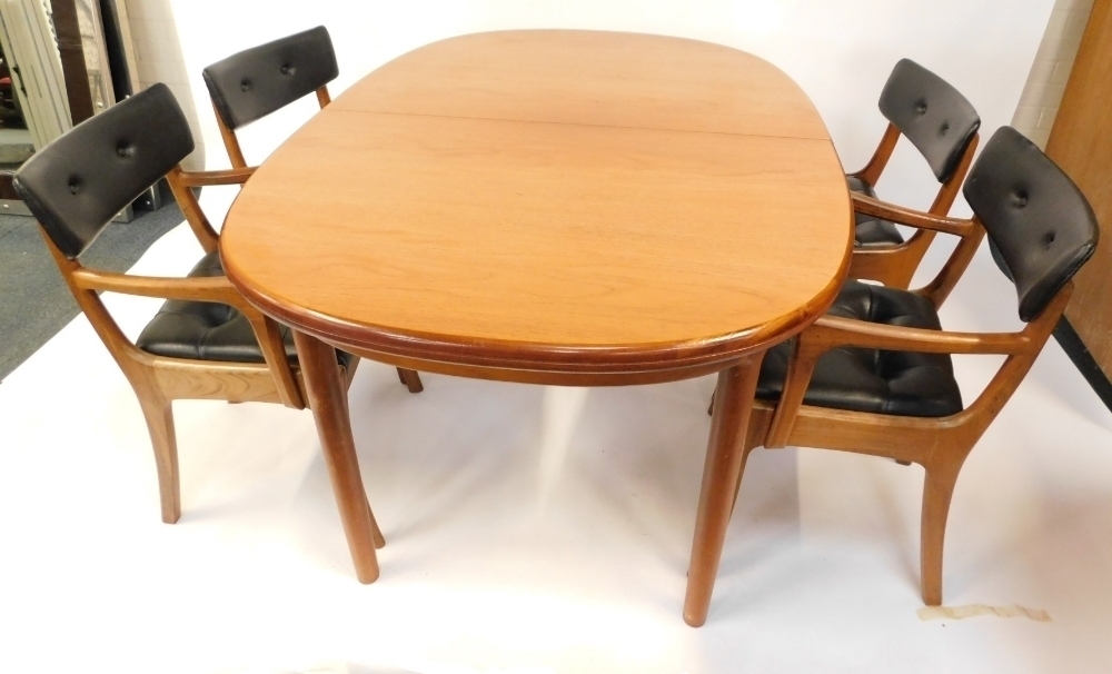A Vanson retro teak dining suite, an extending dining table, on tapered ...