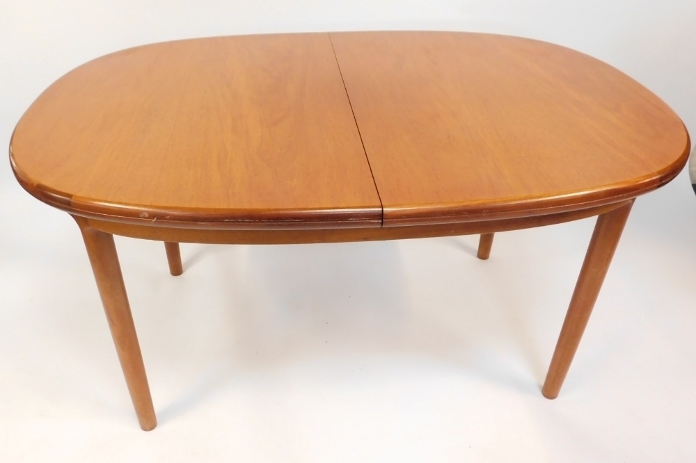 A Vanson retro teak dining suite, an extending dining table, on tapered ...