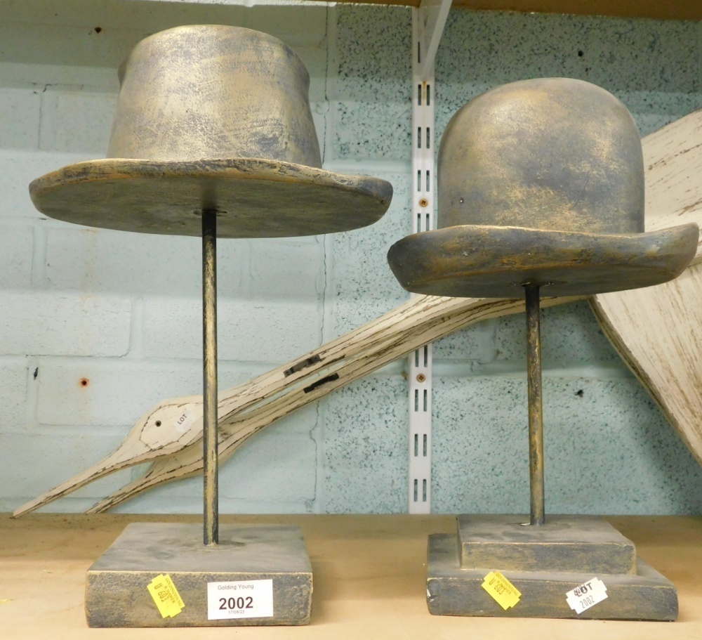 Two various pottery hat sculptures.